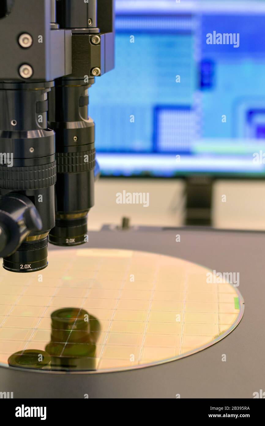 Silicon wafer on machine process examining in microscope Stock Photo ...