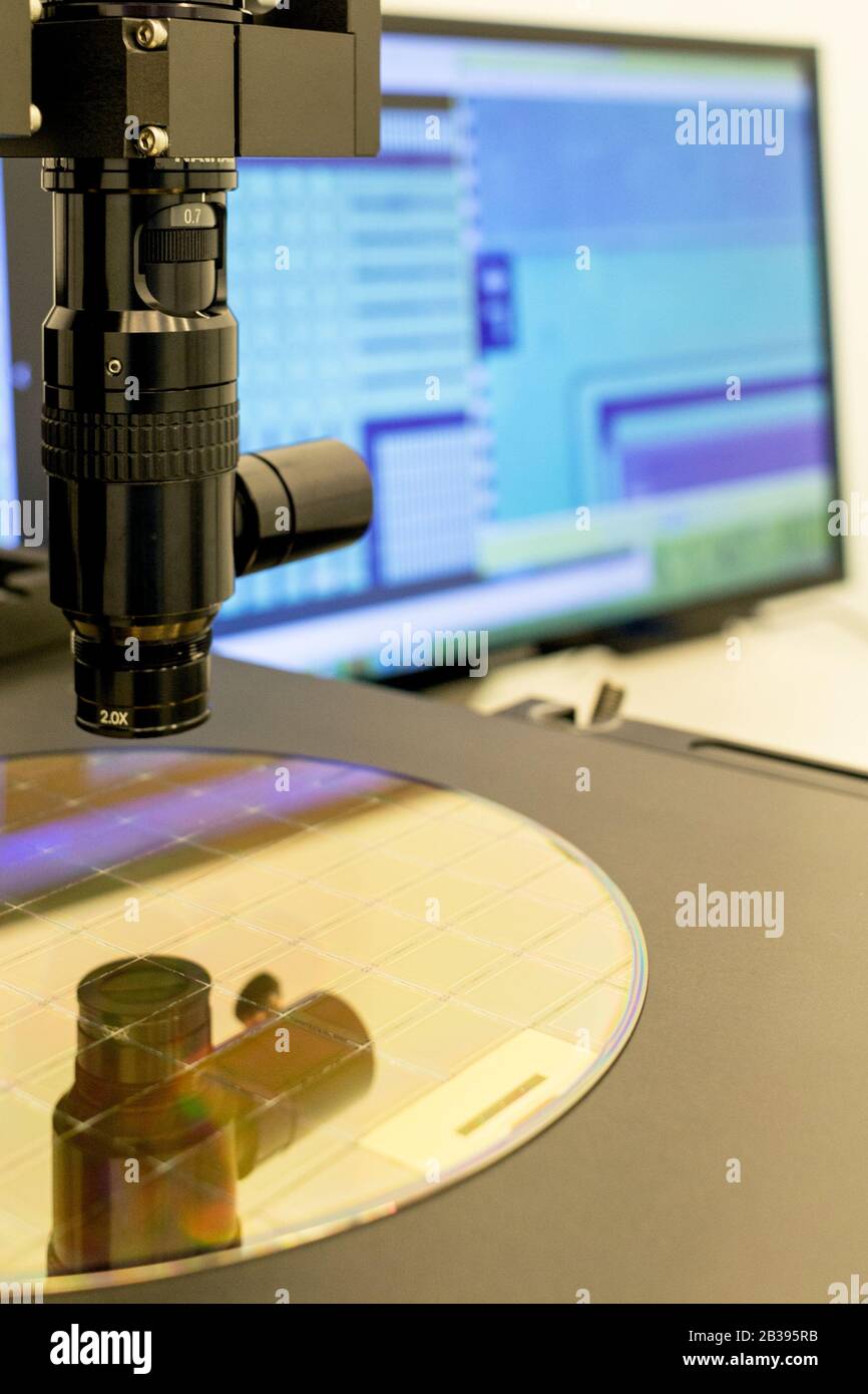 Silicon wafer on machine process examining in microscope Stock Photo ...