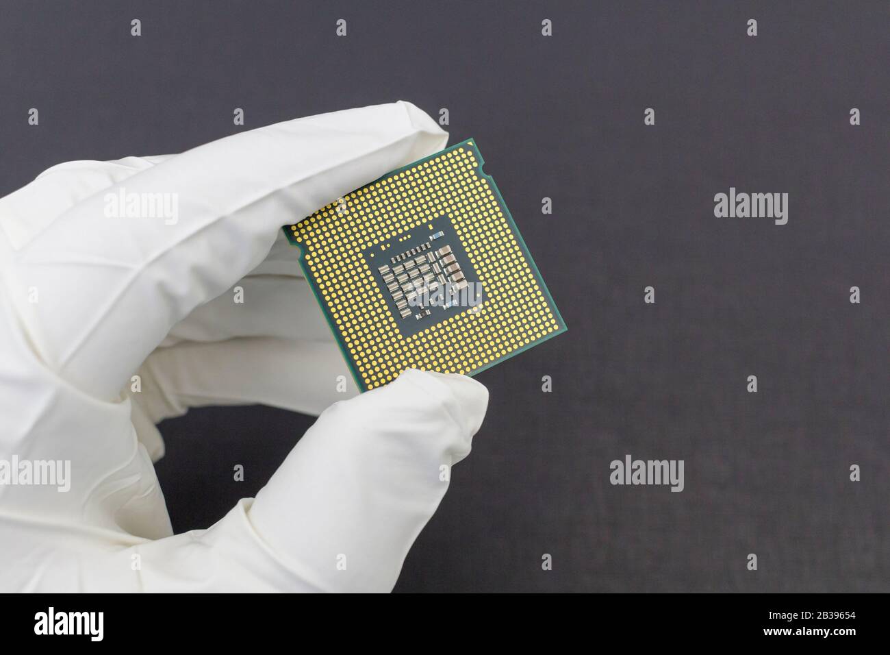 Hand in white glove holding a CPU computer processor microchip Stock ...