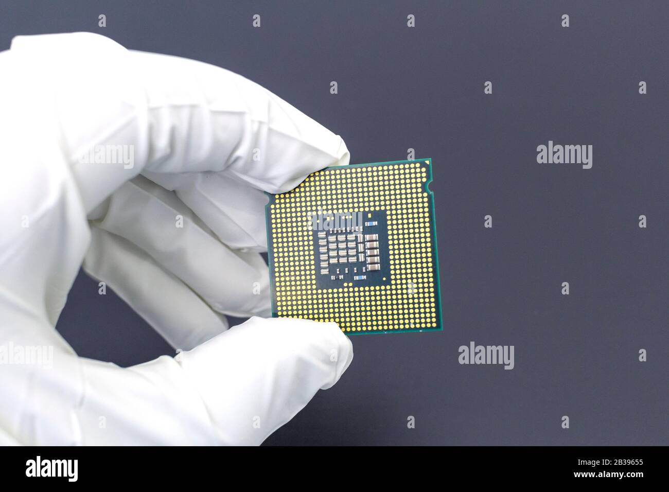 Hand in white glove holding a CPU computer processor microchip Stock ...
