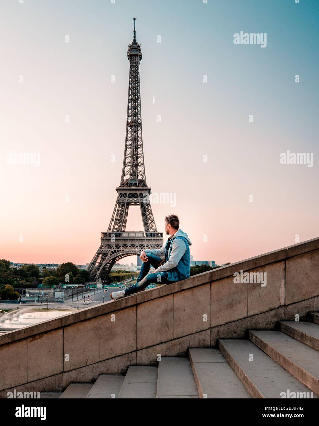 young men watching Eiffel tower in Paris. guy tourist visiting Paris ...