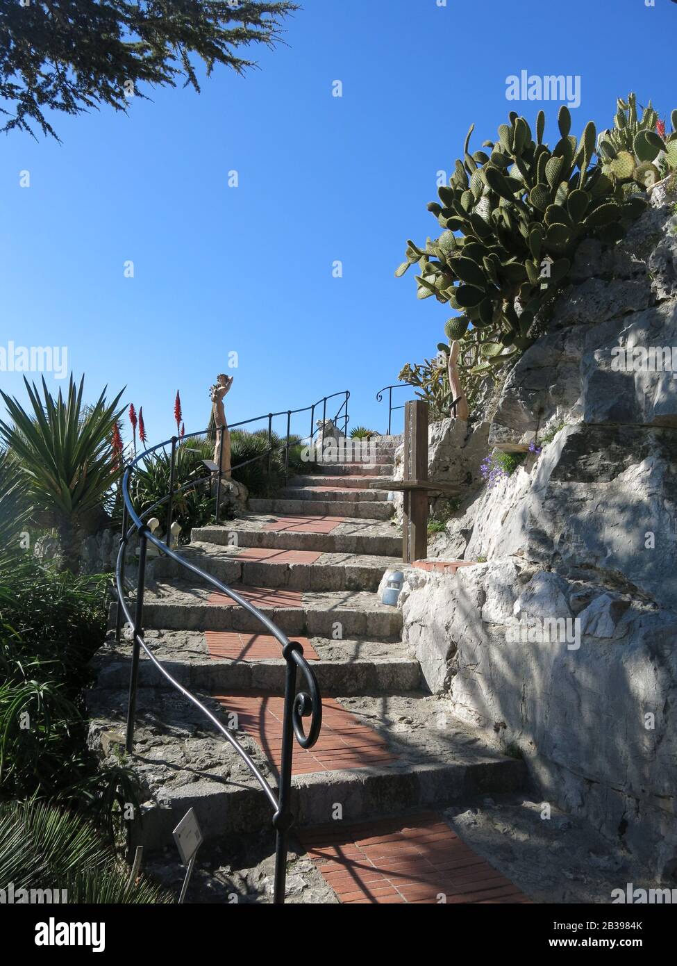 Winding staircase and iron railing disappearing up into the blue skies ...