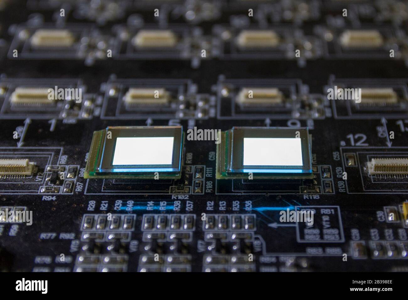 The process of checking several oled displays of white color on the ...