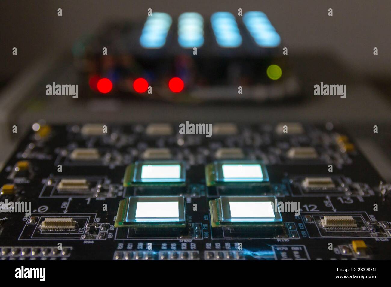 The process of checking several oled displays of white color on the ...