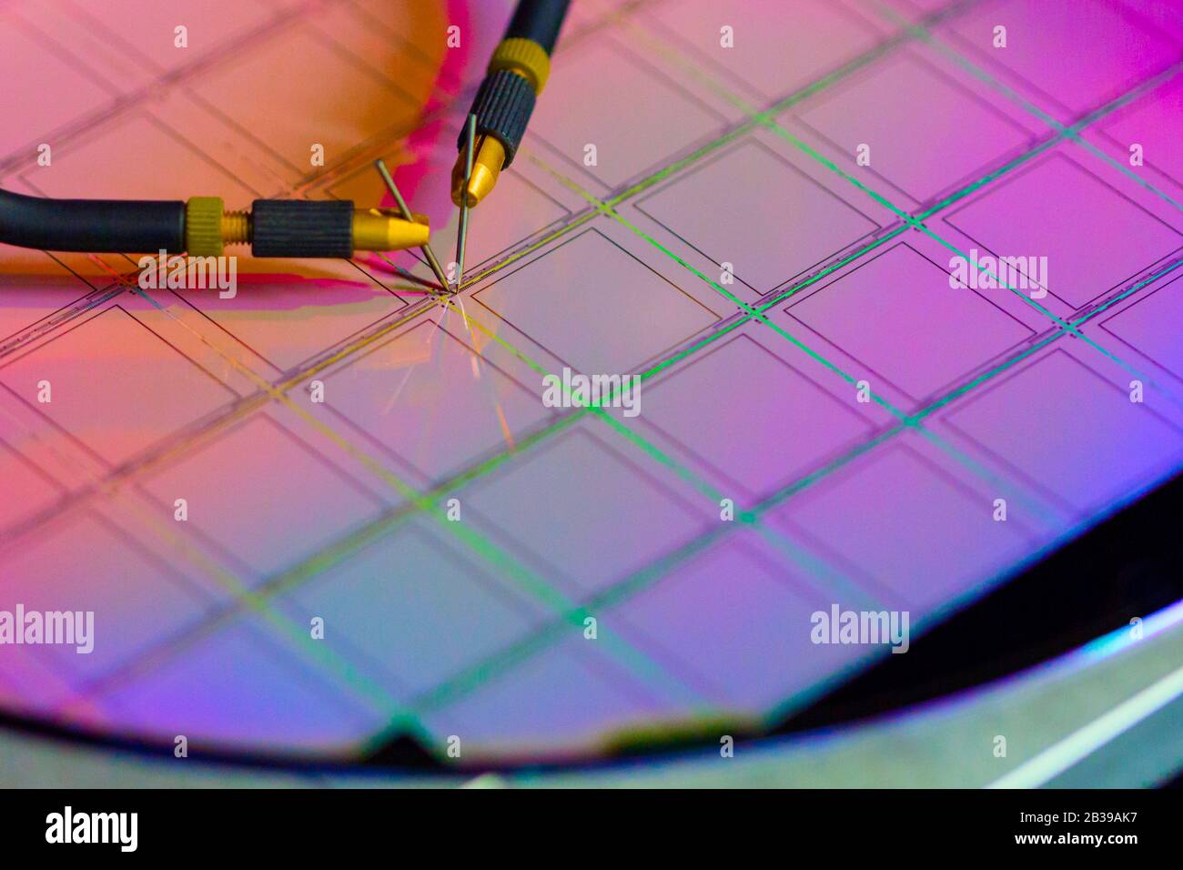 Checking microchips on silicon wafer with probe station.Close up ...