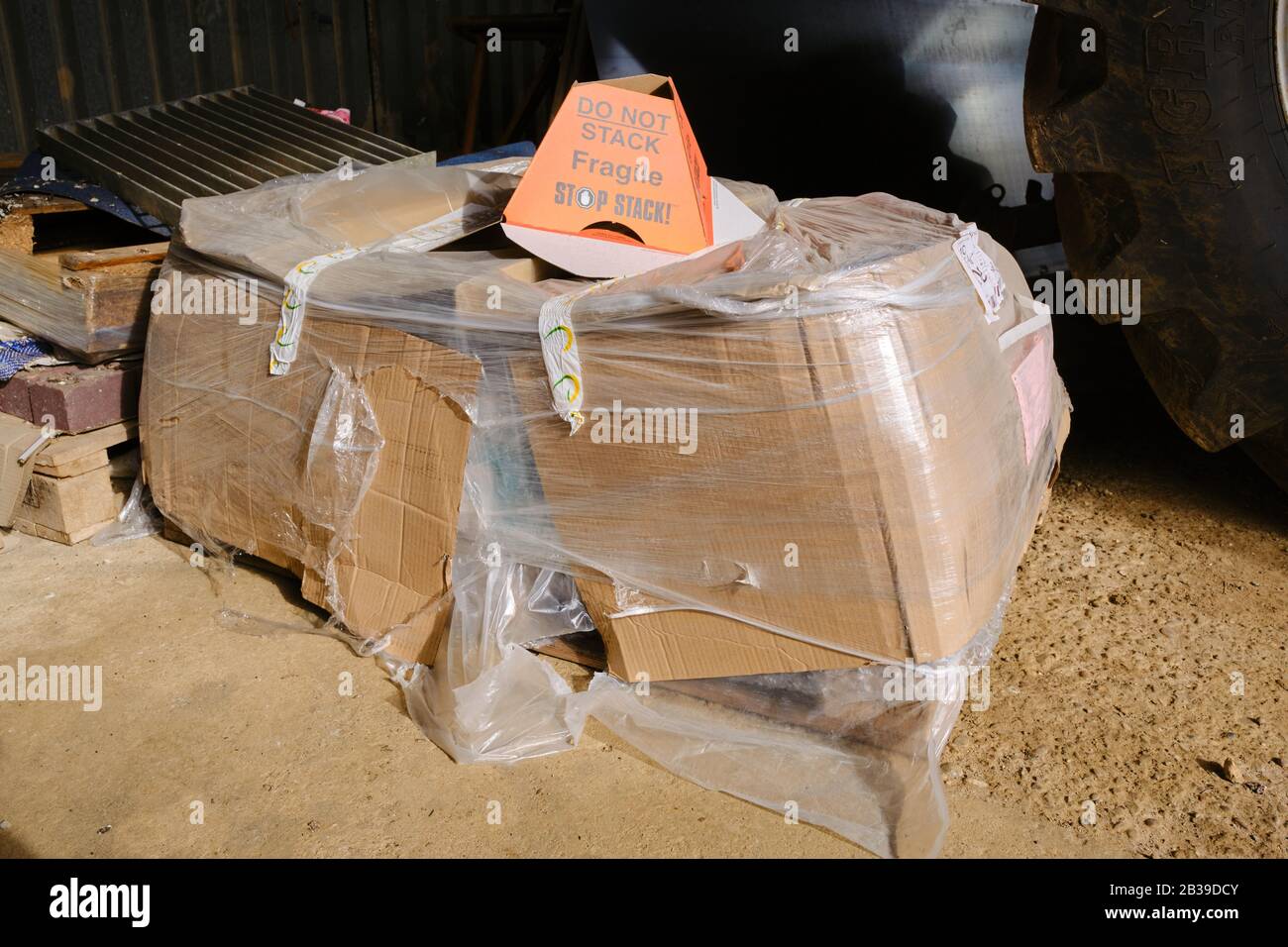 A Stop Stack anti crush device stating fragile do not stack atop a ...