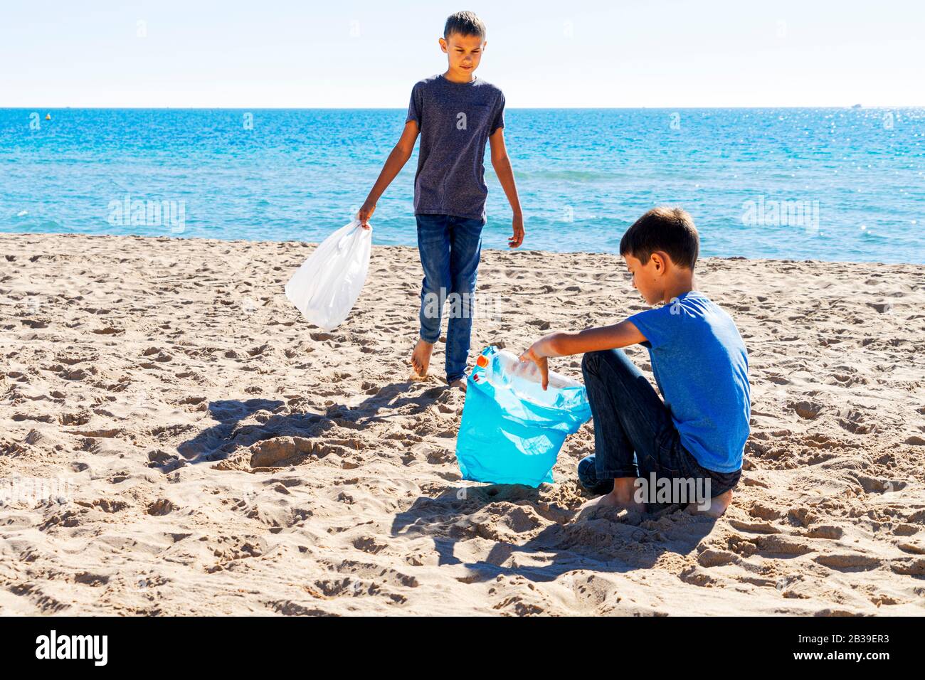 Kids Picking Up Trash On The Beach