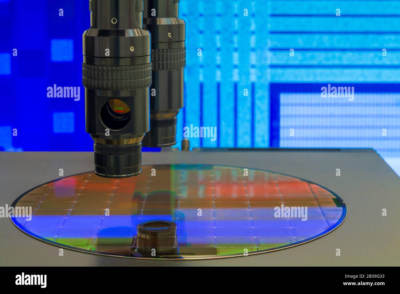 Silicon wafer with semiconductor microchip on machine process examining ...