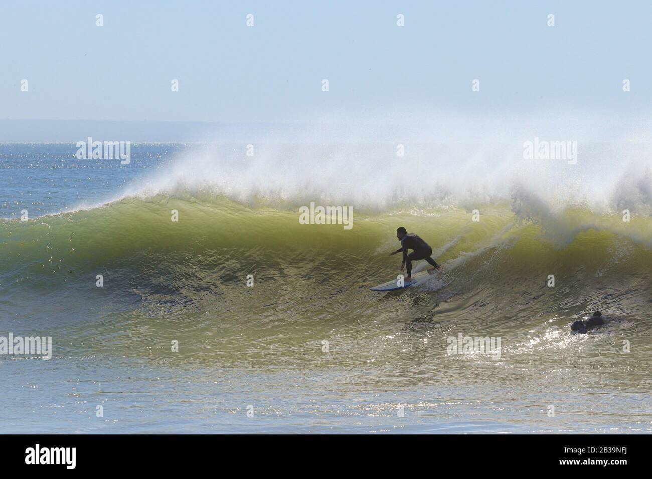 Surfer on Blue Ocean Wave Stock Photo - Alamy