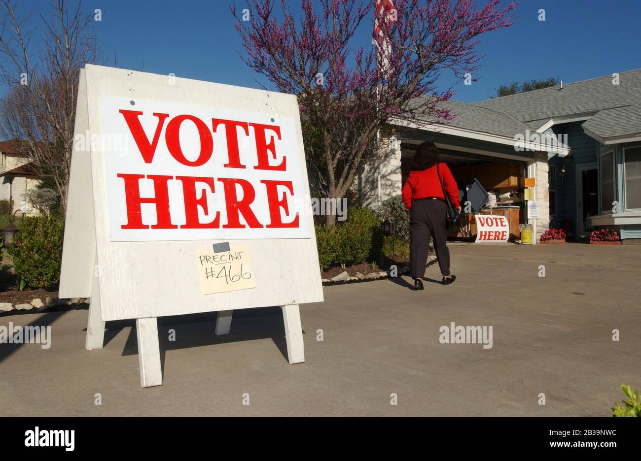 Austin, Texas USA, March 9, 2004: Woman walks into homeowner's garage ...