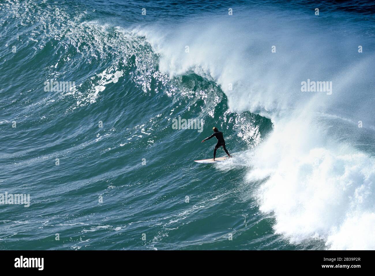 Surfer on Blue Ocean Wave Stock Photo - Alamy