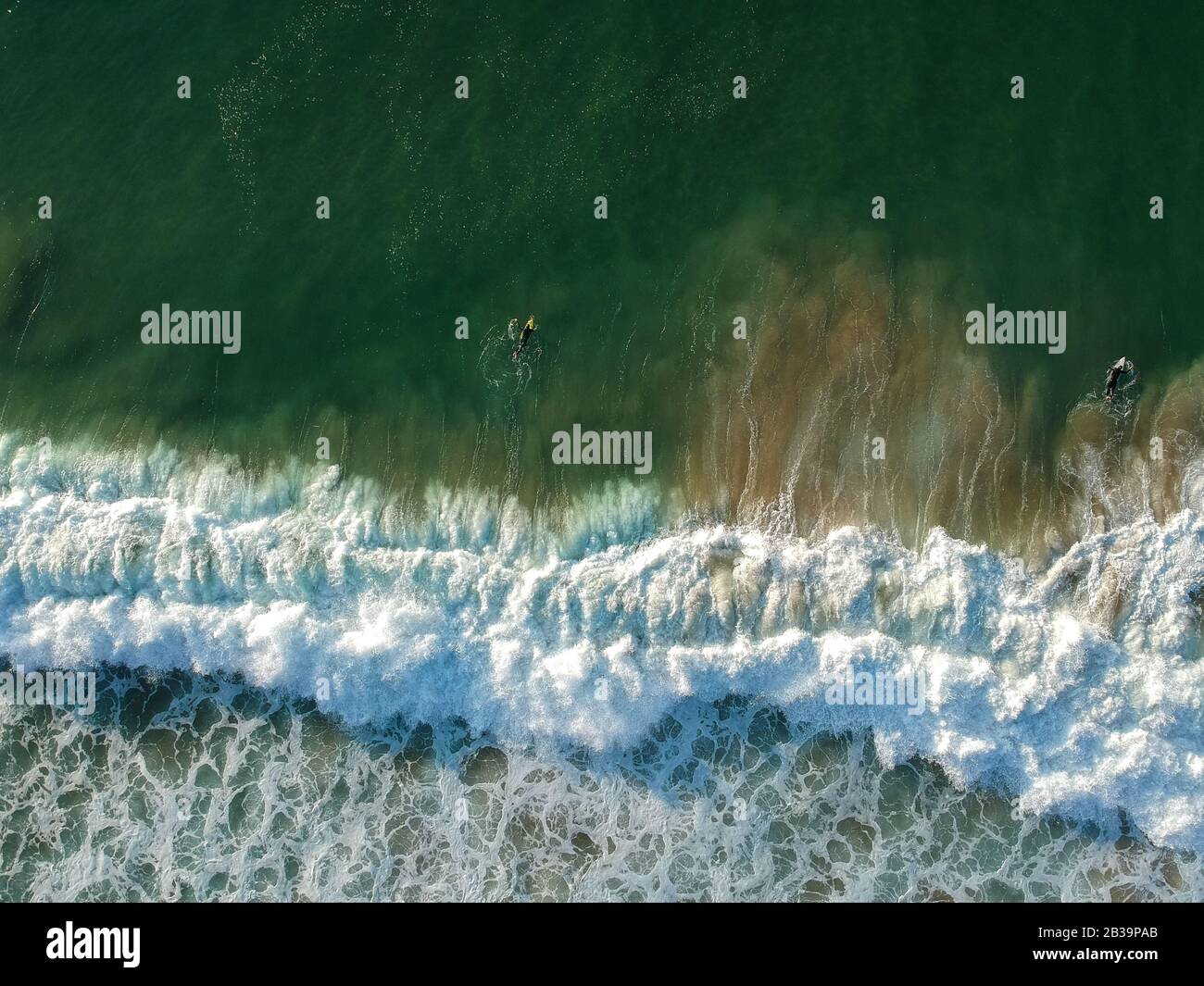 Beach shot with deep blue sea and golden sand hi-res stock photography ...
