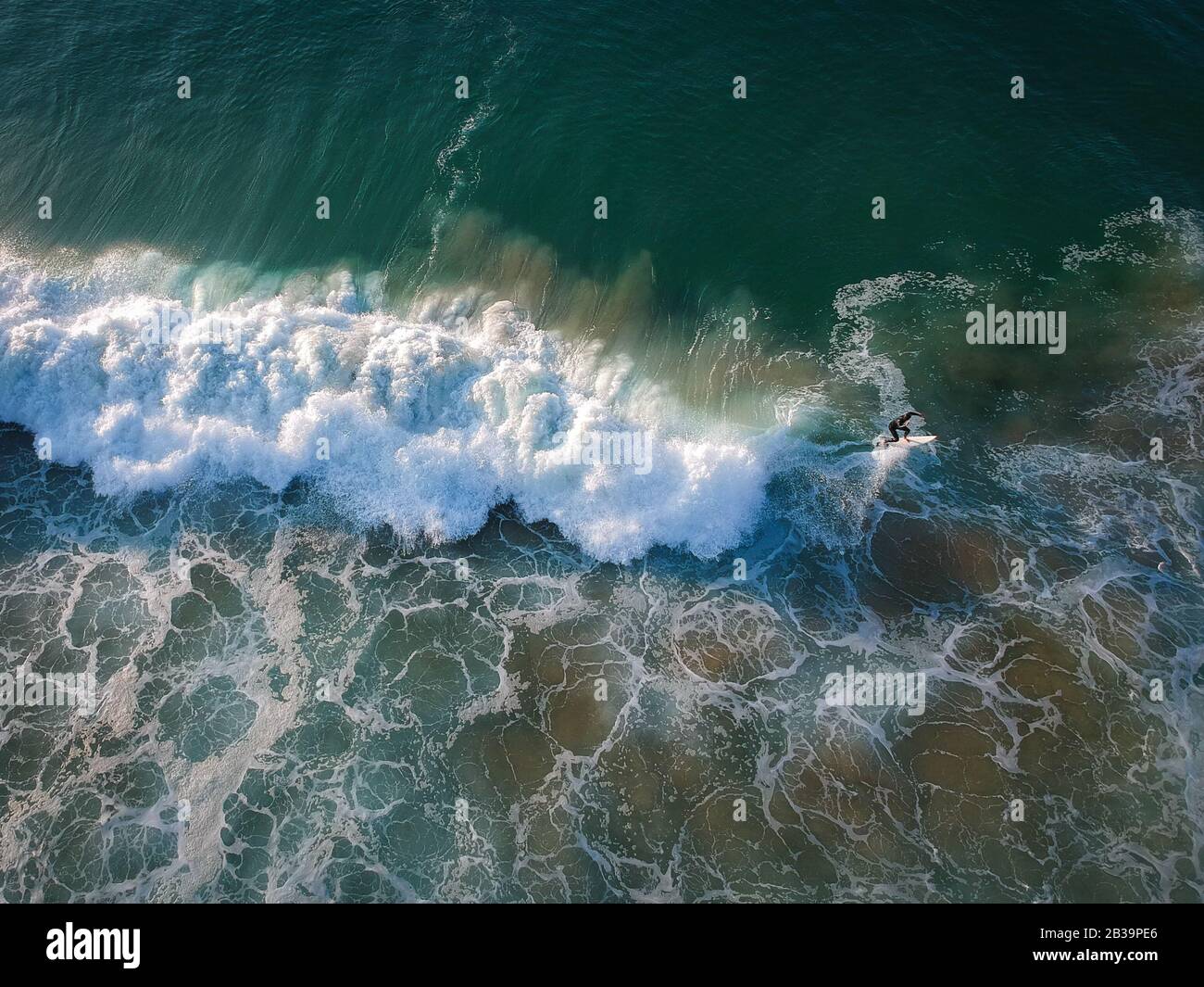 Beach shot with deep blue sea and golden sand hi-res stock photography ...