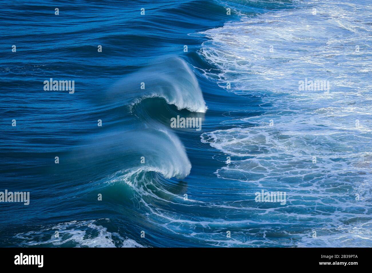Perfect wave breaking perfectly in Nazare Portugal Stock Photo - Alamy