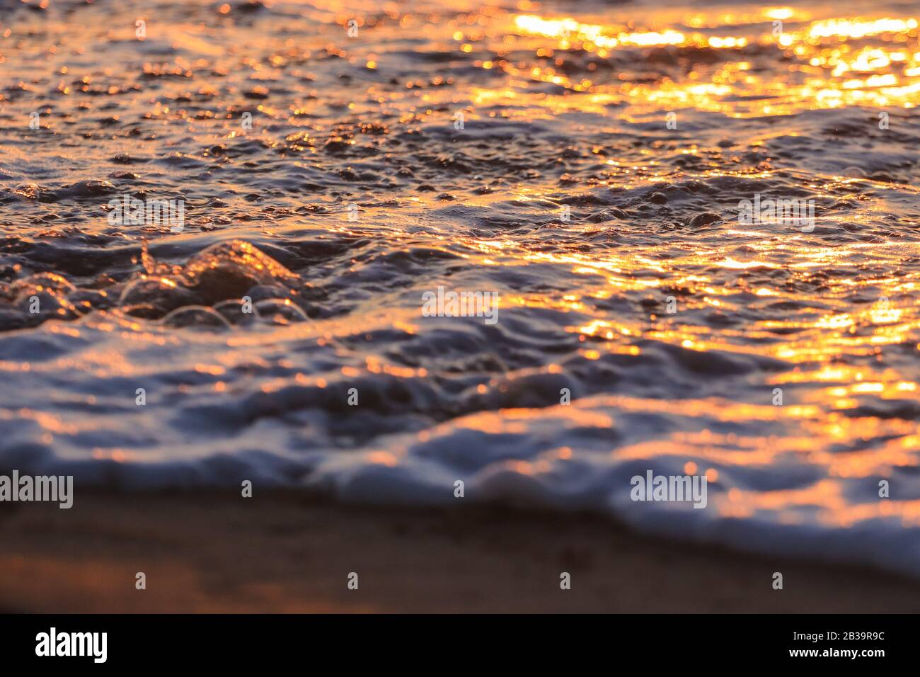 Wave foam in sea hi-res stock photography and images - Alamy