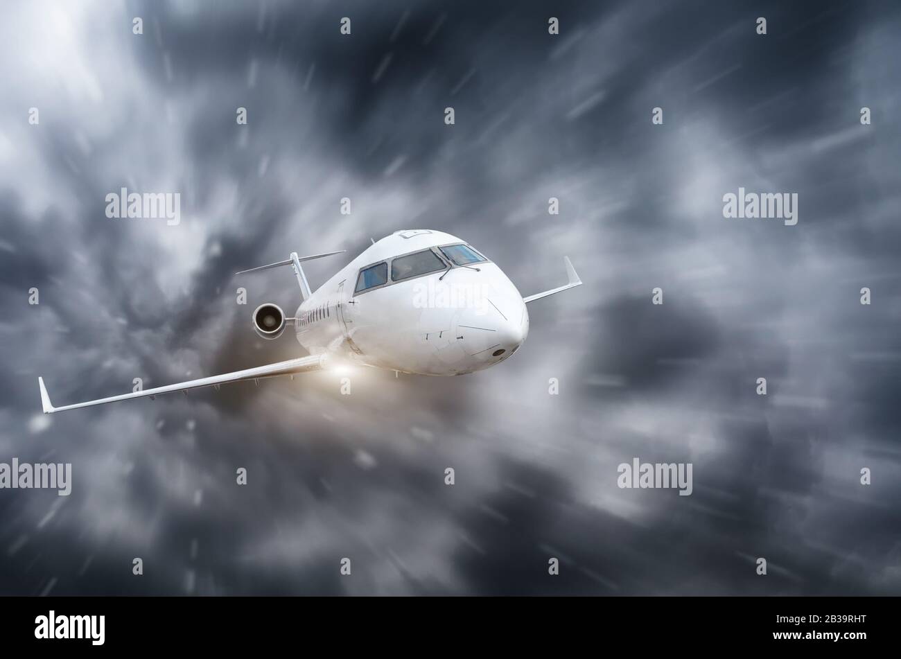 The plane flies during a storm and heavy rain overcast Stock Photo - Alamy