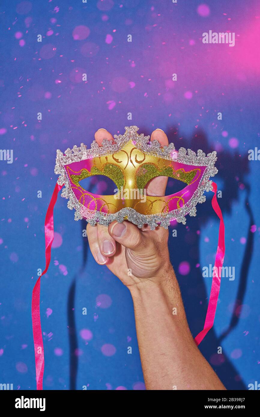 Mardi Gras carnival masquerade mask on blue background with confetti ...