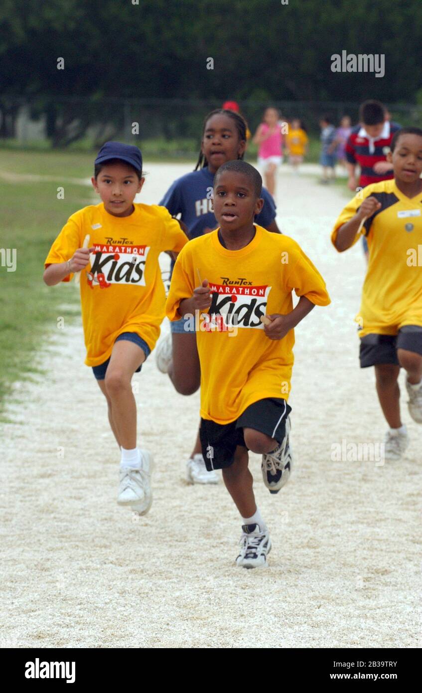 Third grade children running hi-res stock photography and images - Alamy