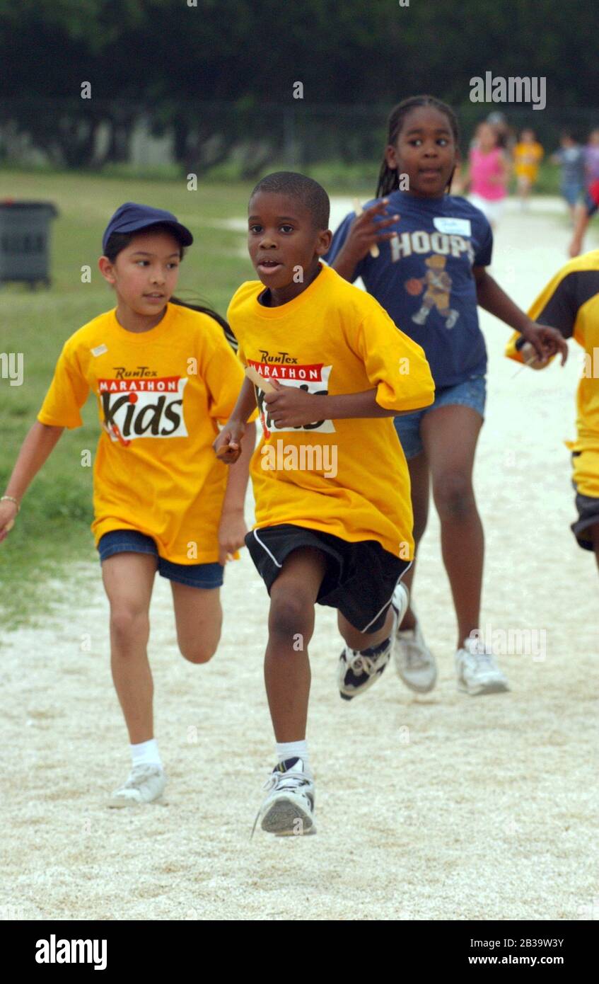 Third grade children running hi-res stock photography and images - Alamy