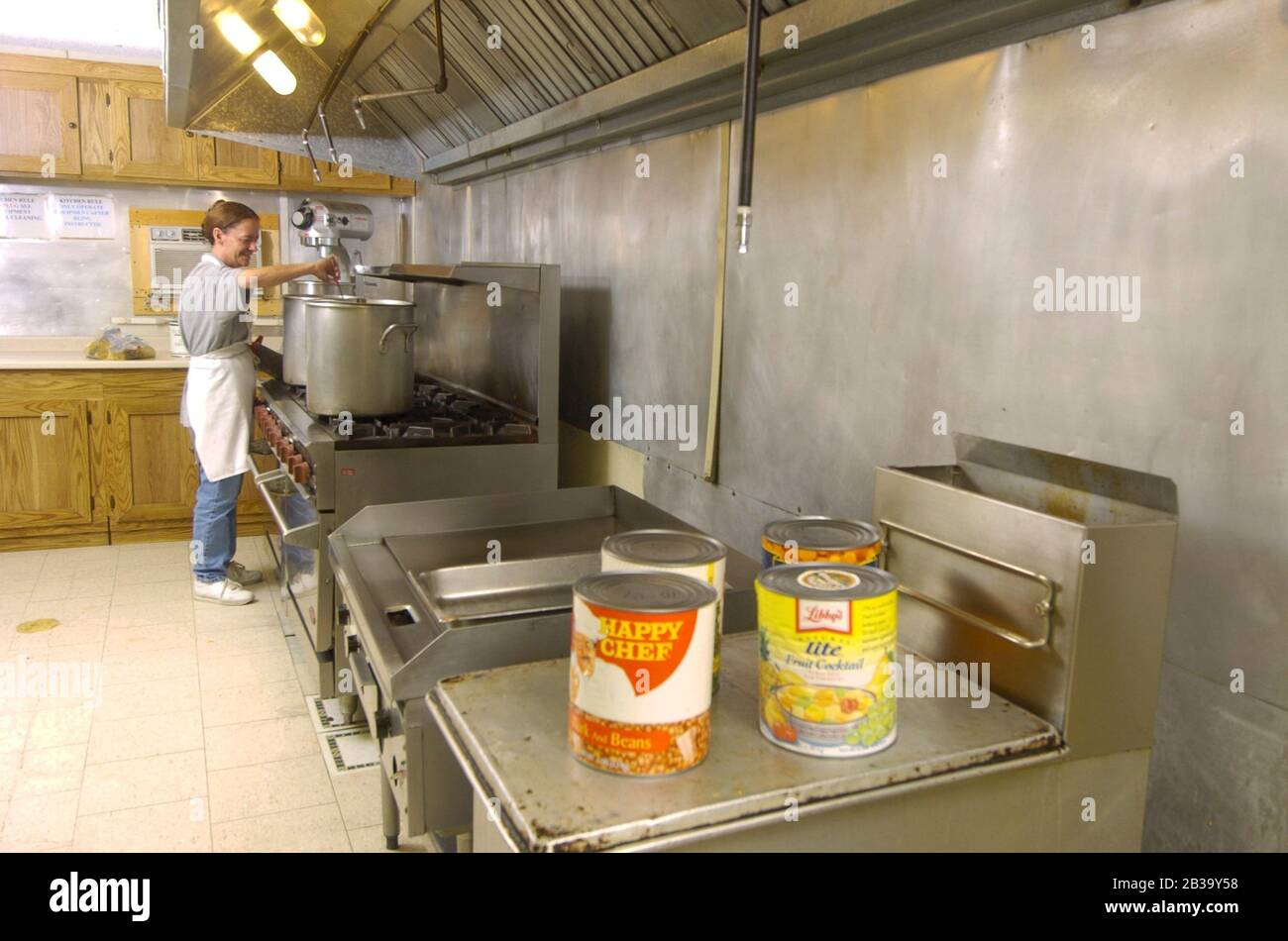 Del Valle, Texas, Oct. 25, 2004: Woman cooking in the commercial ...