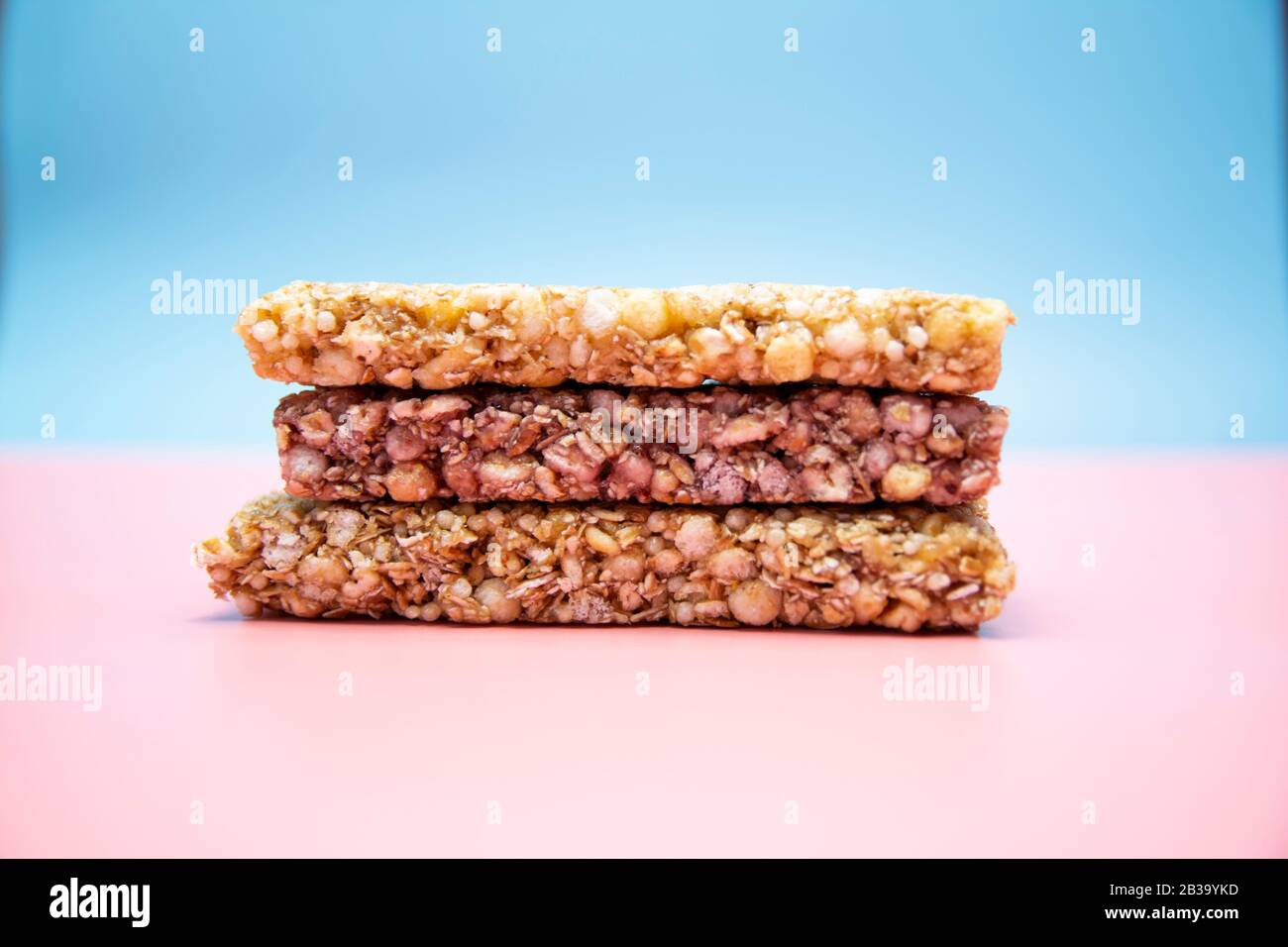 healthy nutrition protein bars on blue and pink background Stock Photo ...