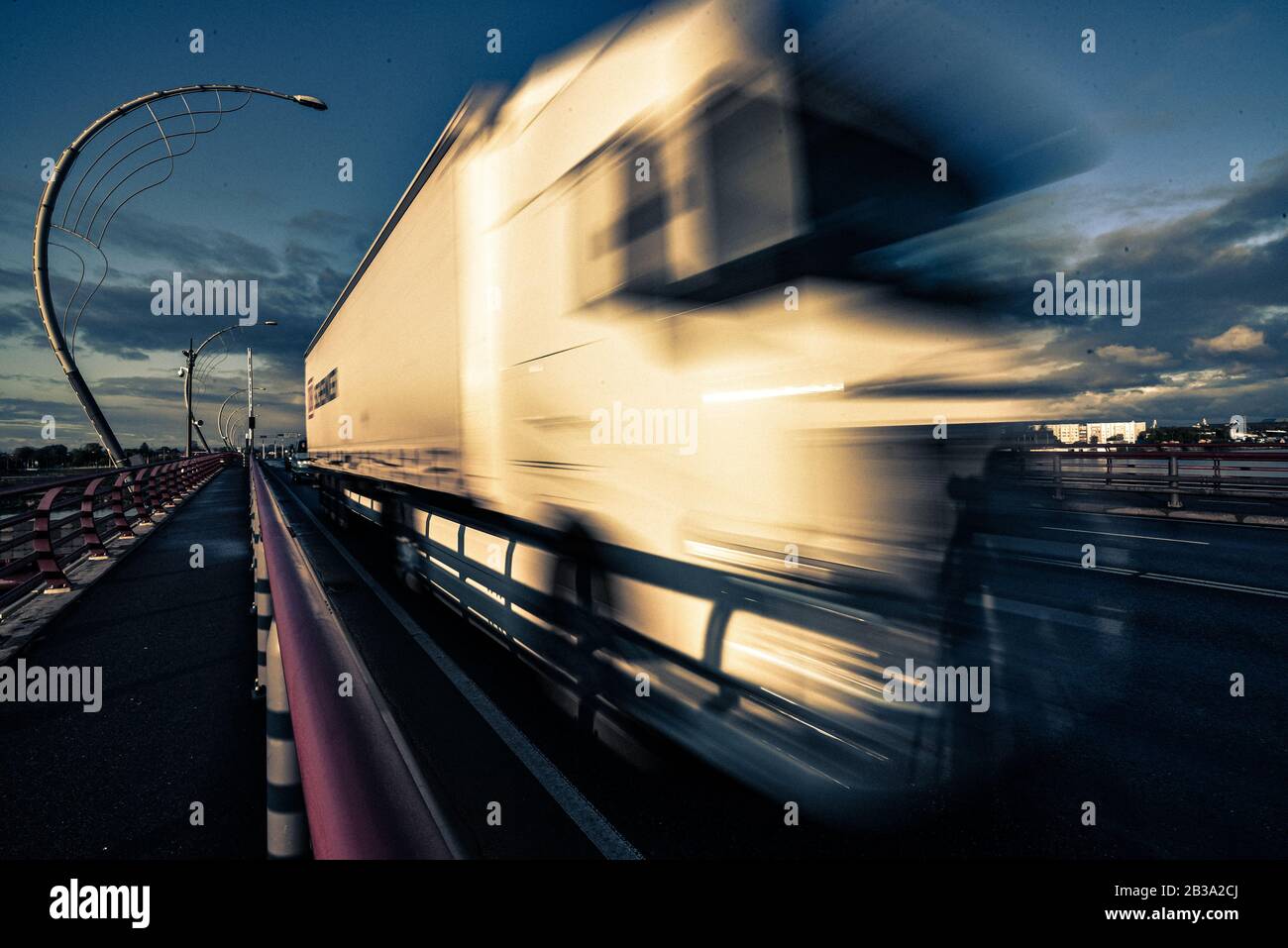 the lorry pulls over the drawbar pulling a heavy load behind it and ...