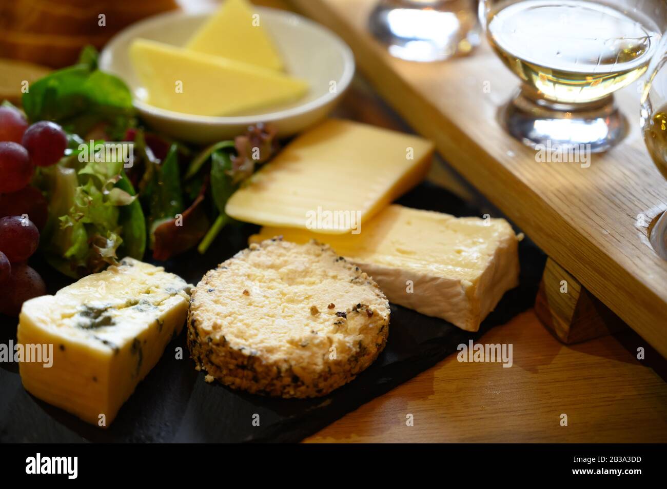 Tasting of original scottish cheese and whisky, plate with scottish ...