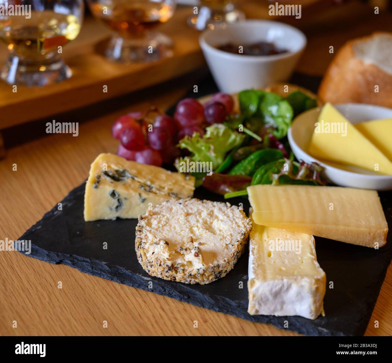 Tasting of original scottish cheese and whisky, plate with scottish ...
