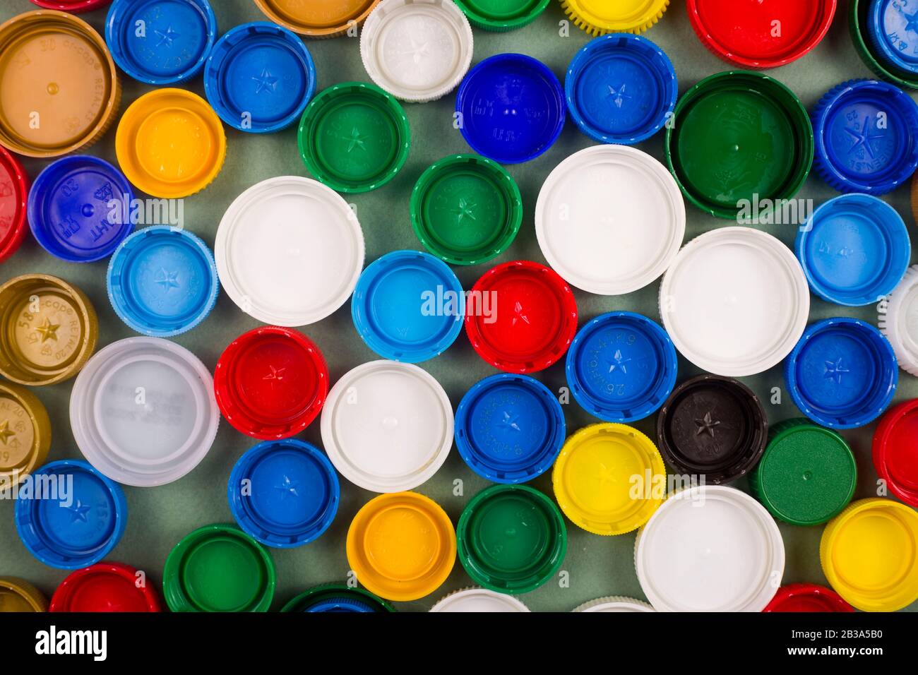A lot of multi-colored caps from plastic bottles for recycling. Zero ...