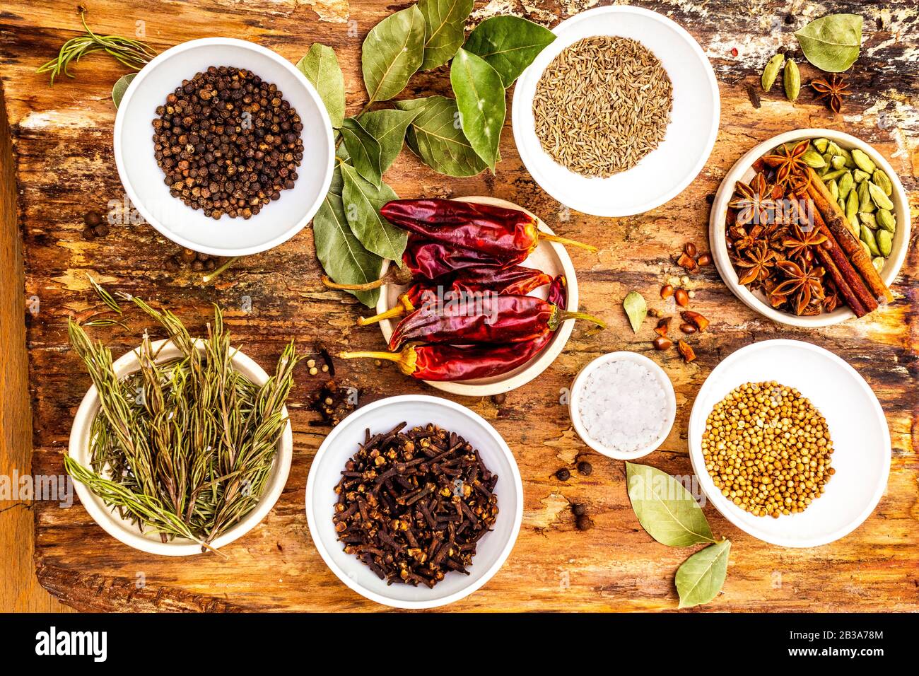 Set of different spices and herbs - black pepper, allspice, rosemary ...