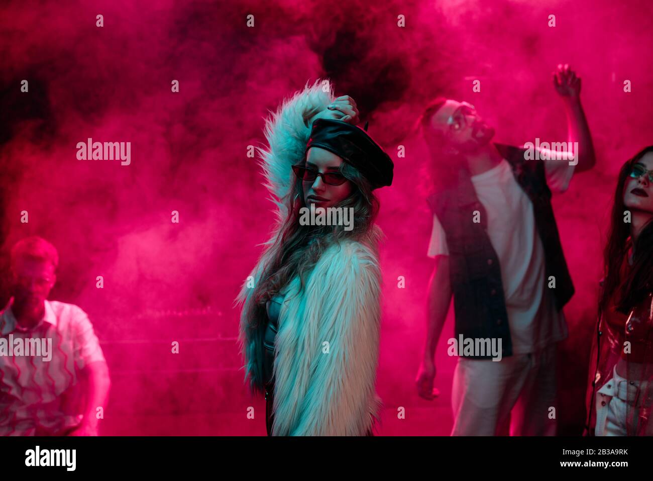 girl dancing in nightclub during rave with pink smoke Stock Photo - Alamy