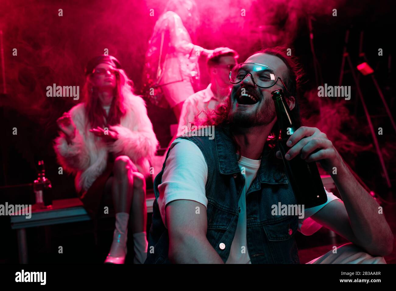happy man with beer laughing in nightclub during rave Stock Photo - Alamy