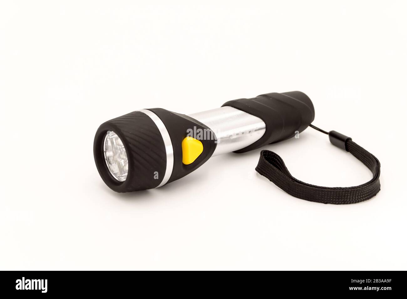 Electric black torch with an orange switch isolate on a black ...