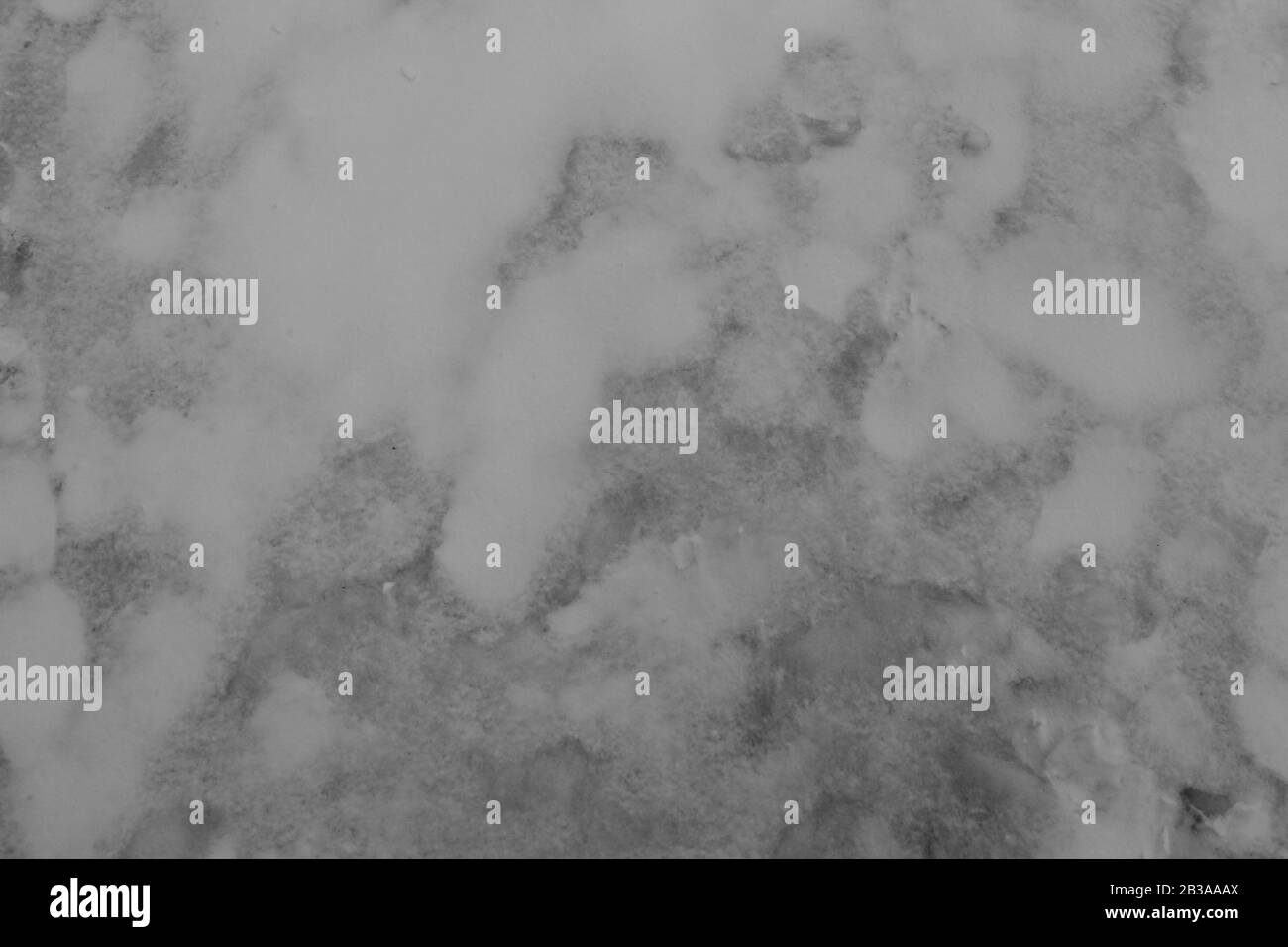 Surface covered with gray snow and ice. Winter background for design ...