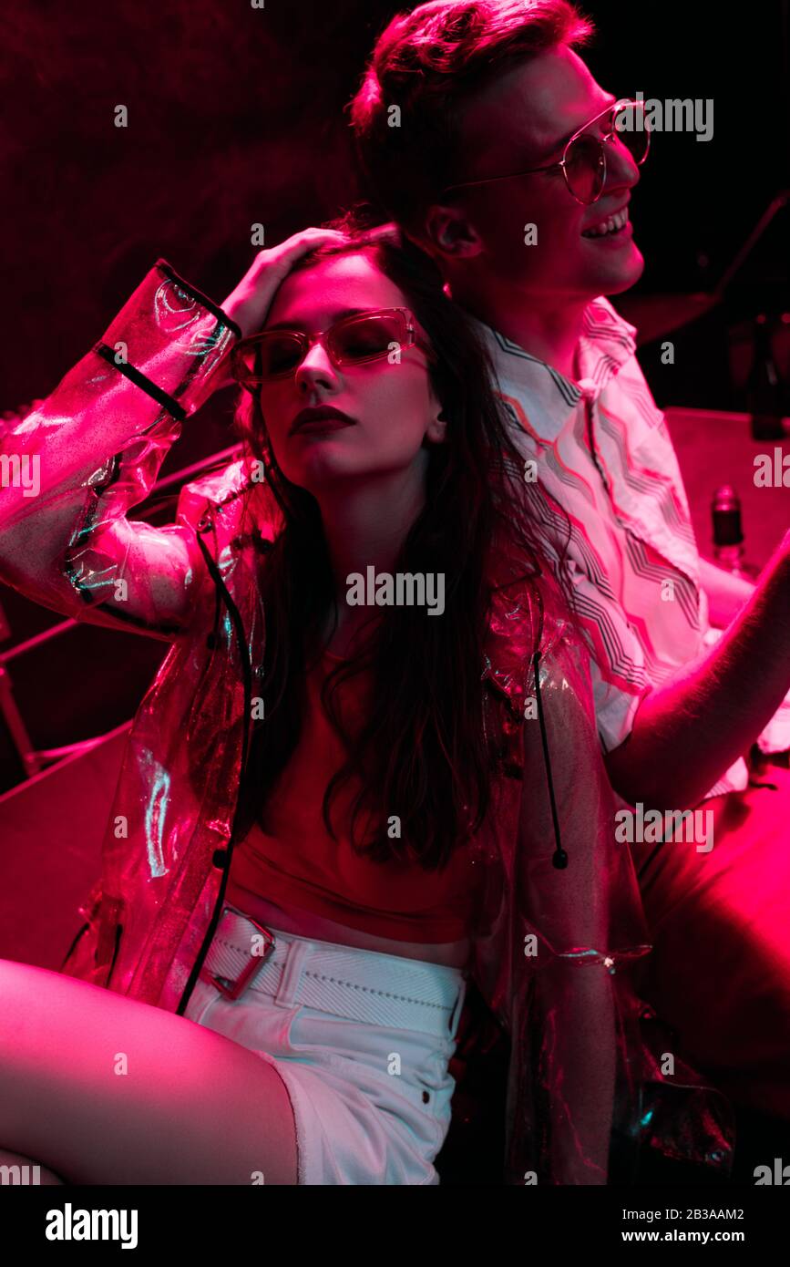 man and young woman sunglasses during rave party in nightclub Stock ...
