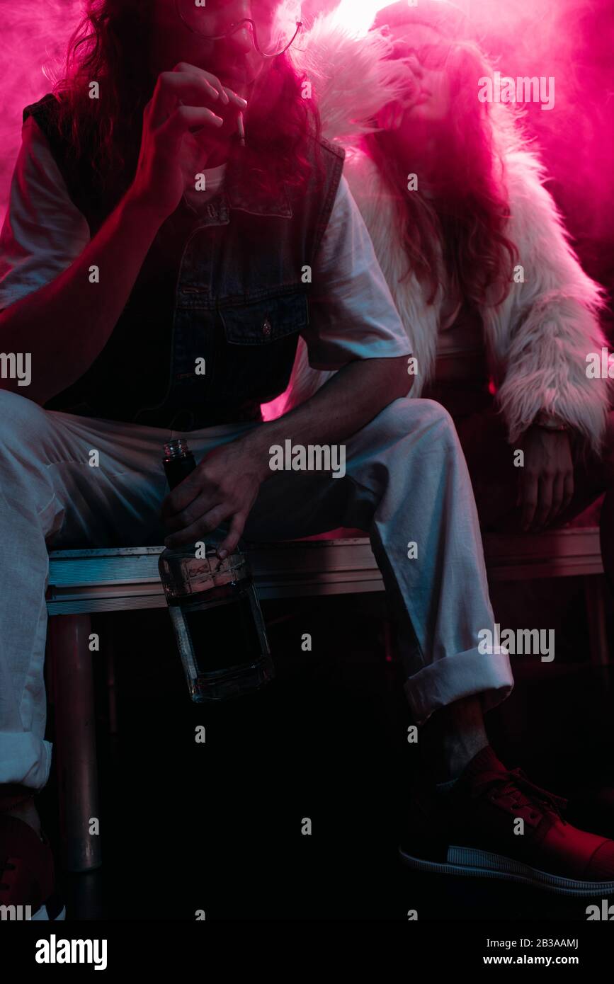 Woman smoking in nightclub hi-res stock photography and images - Alamy