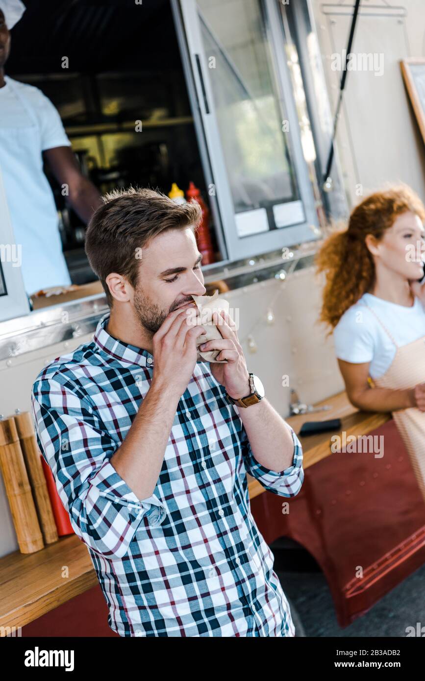 Three men eating together restaurant hi-res stock photography and ...