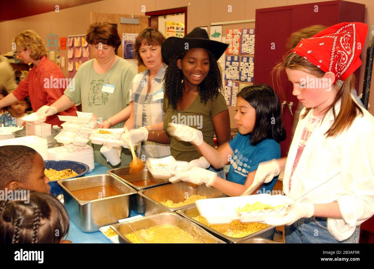 Austin, Texas USA, March 1, 2002: Fifth graders serve lunch to the ...