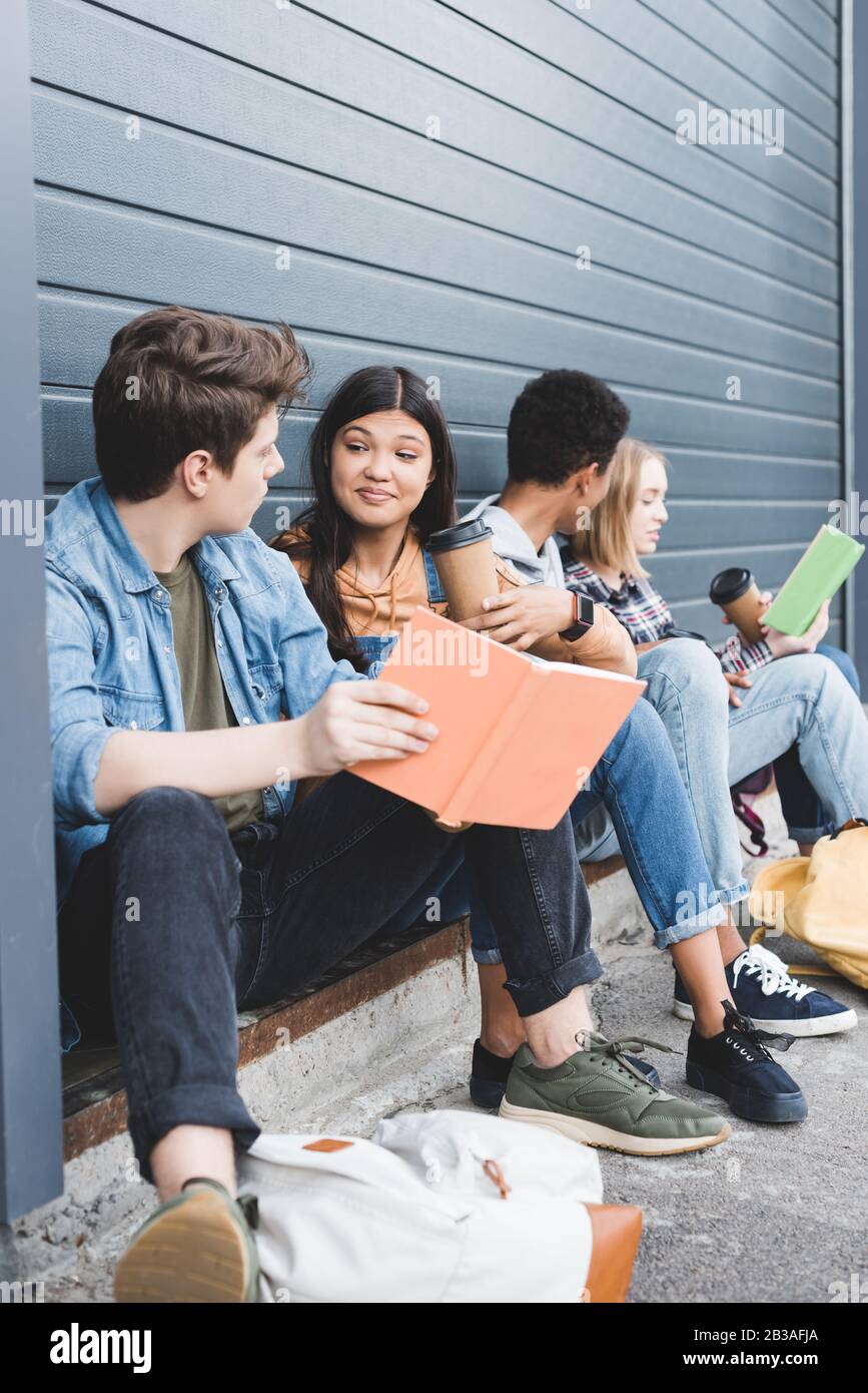 Outside talking teenagers sitting hi-res stock photography and images ...