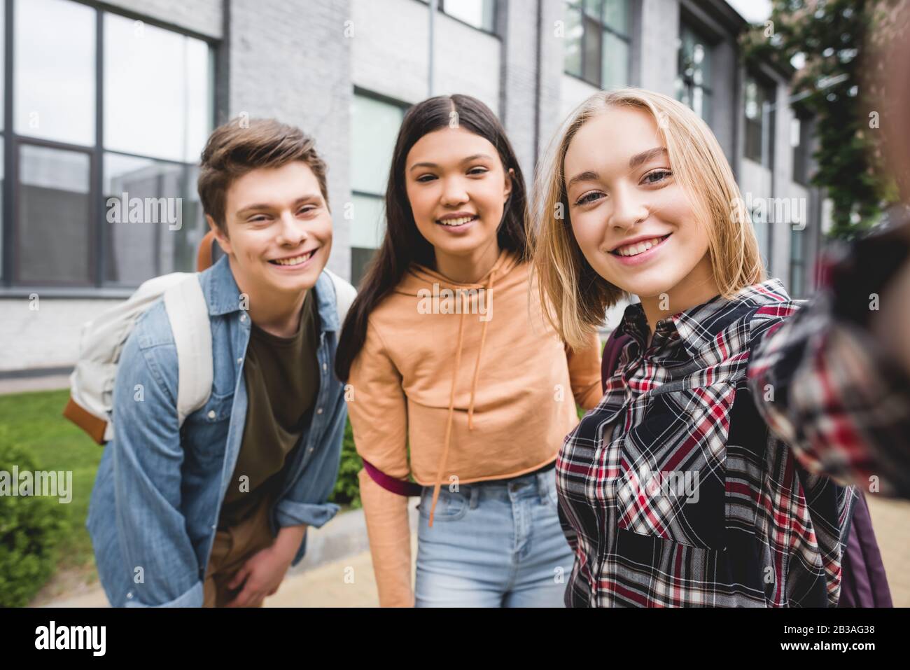happy teenagers taking selfie, smiling and looking at camera Stock ...