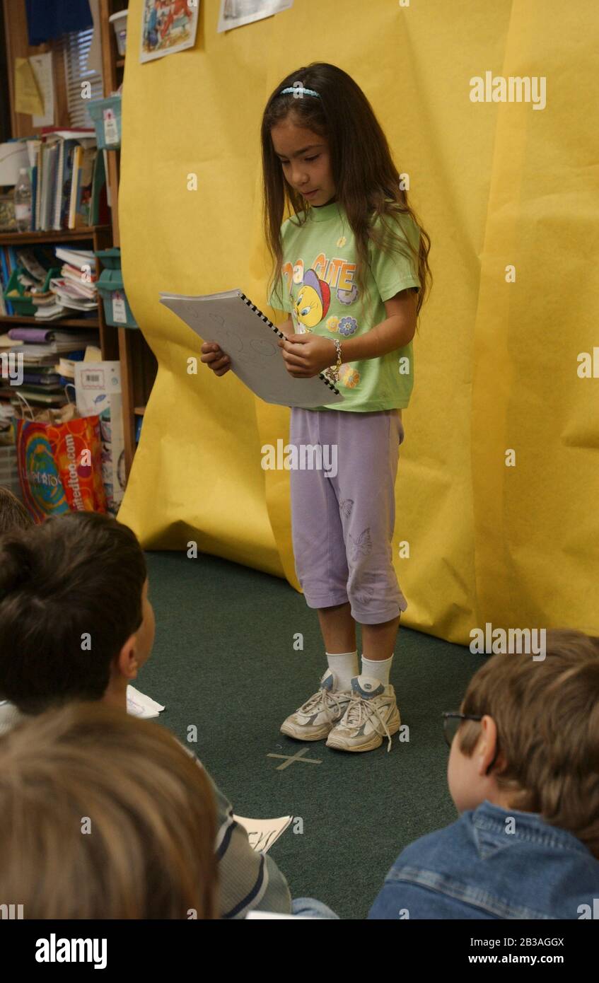 Child reading report in class hi-res stock photography and images - Alamy