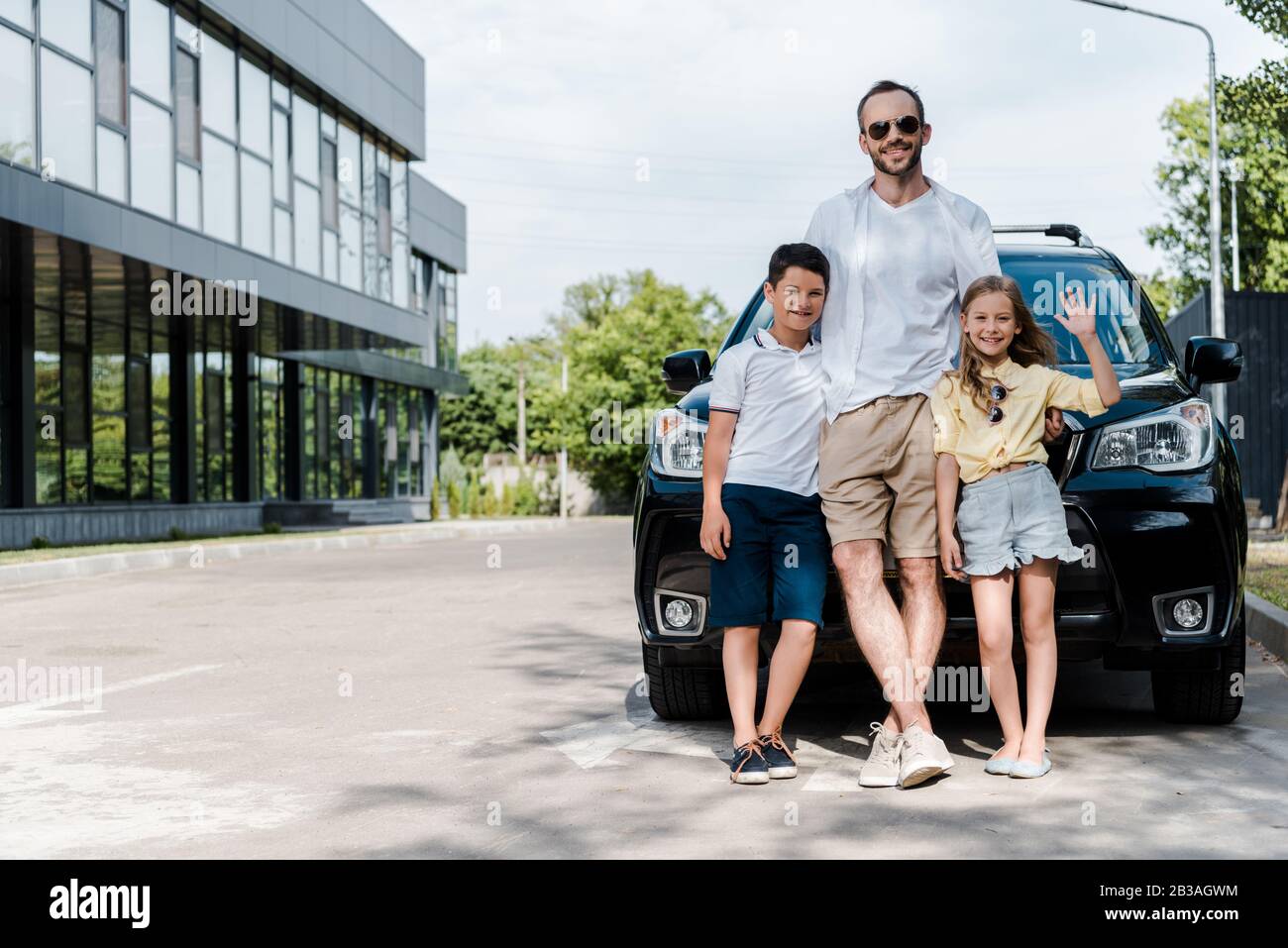 Son and daughter standing hand in hi-res stock photography and images ...