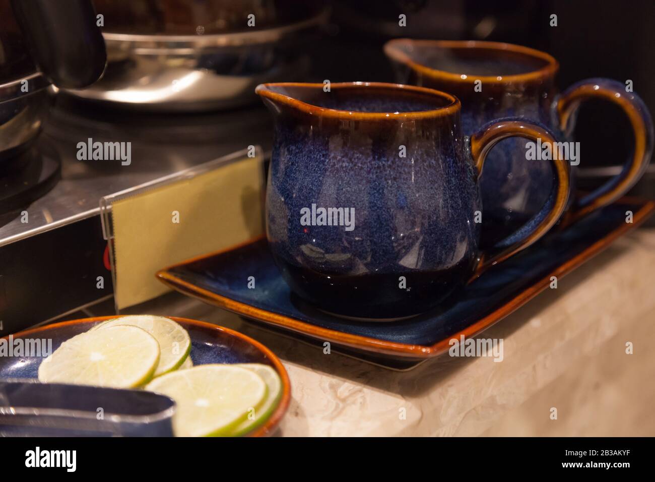 Hand Crafted Vintage Asian Tea Drinking Jugs placed in earthenware tray ...