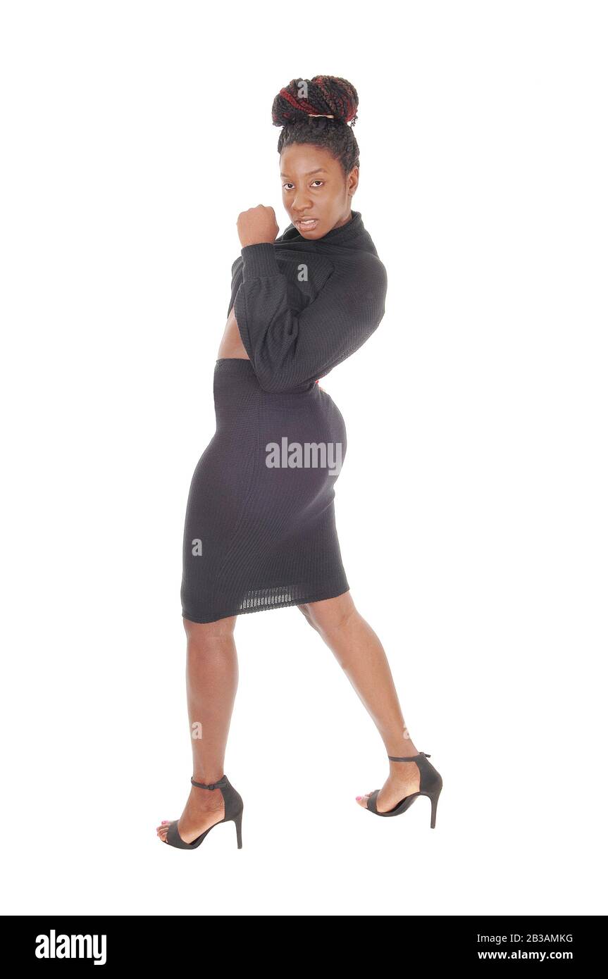 A beautiful young tall African American female standing in a tight gray ...