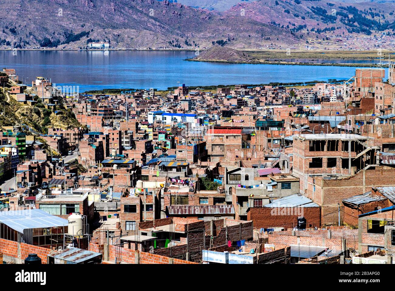 The urban sprawl of Puno blending into the hills around Lake Titicaca ...