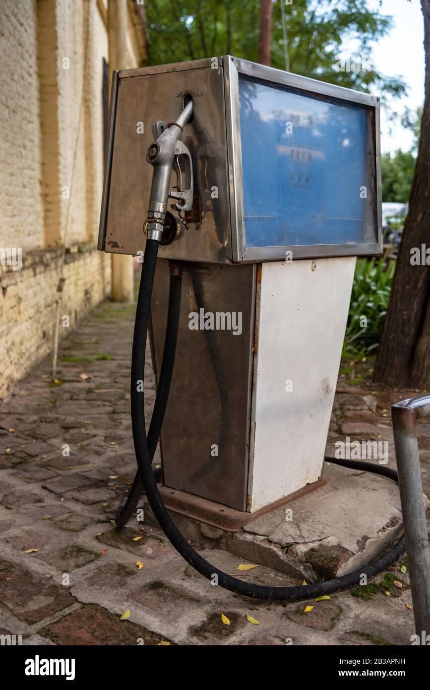 Old dirty gas station, rusted, old and abandoned gas dispenser. The end ...