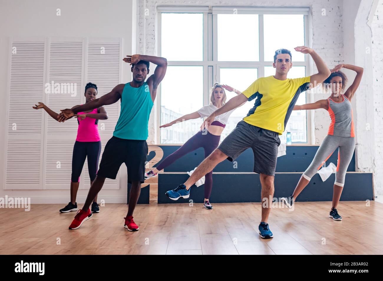 Multicultural dancers performing zumba in dance studio Stock Photo - Alamy