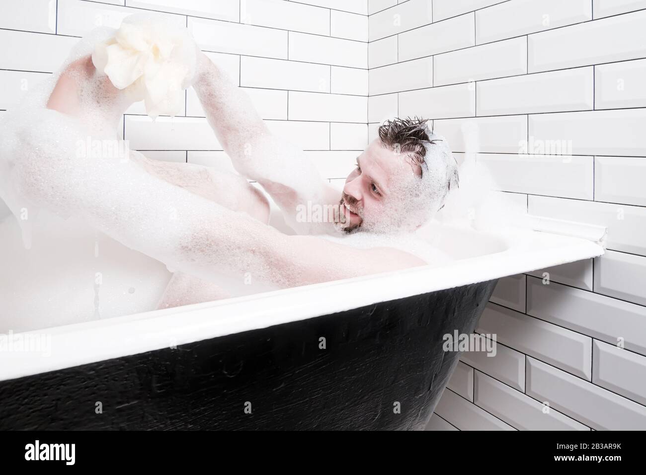 Man bath bubbles hi-res stock photography and images - Alamy