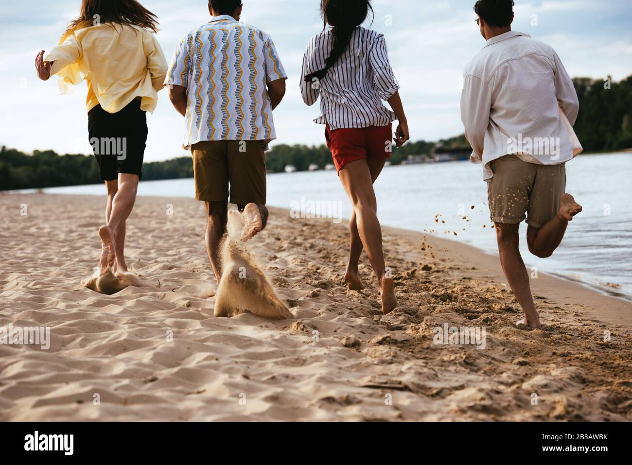 Back view of four friends running hi-res stock photography and images ...