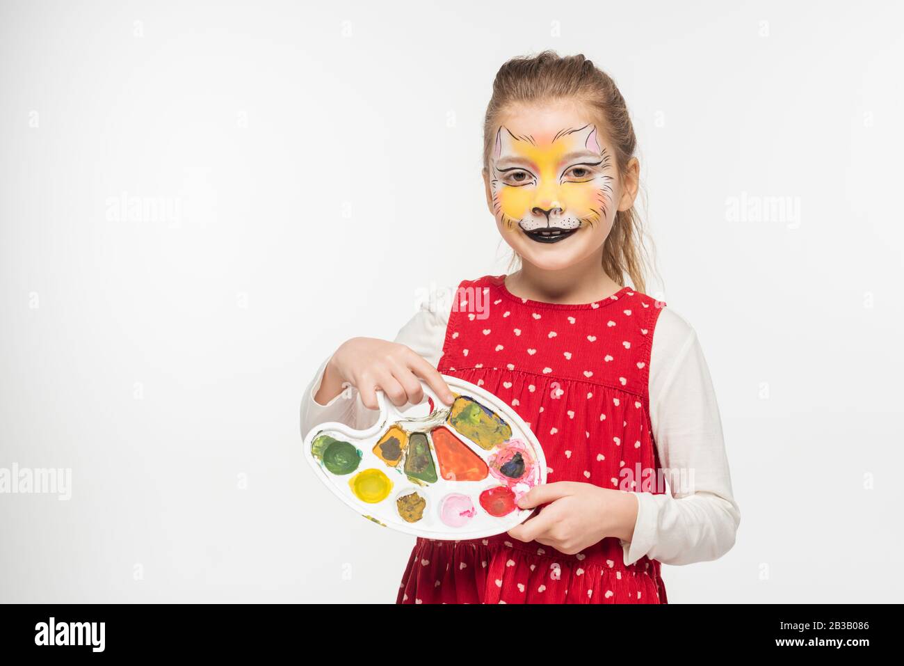 adorable kid with tiger muzzle painting on face holding palette ...